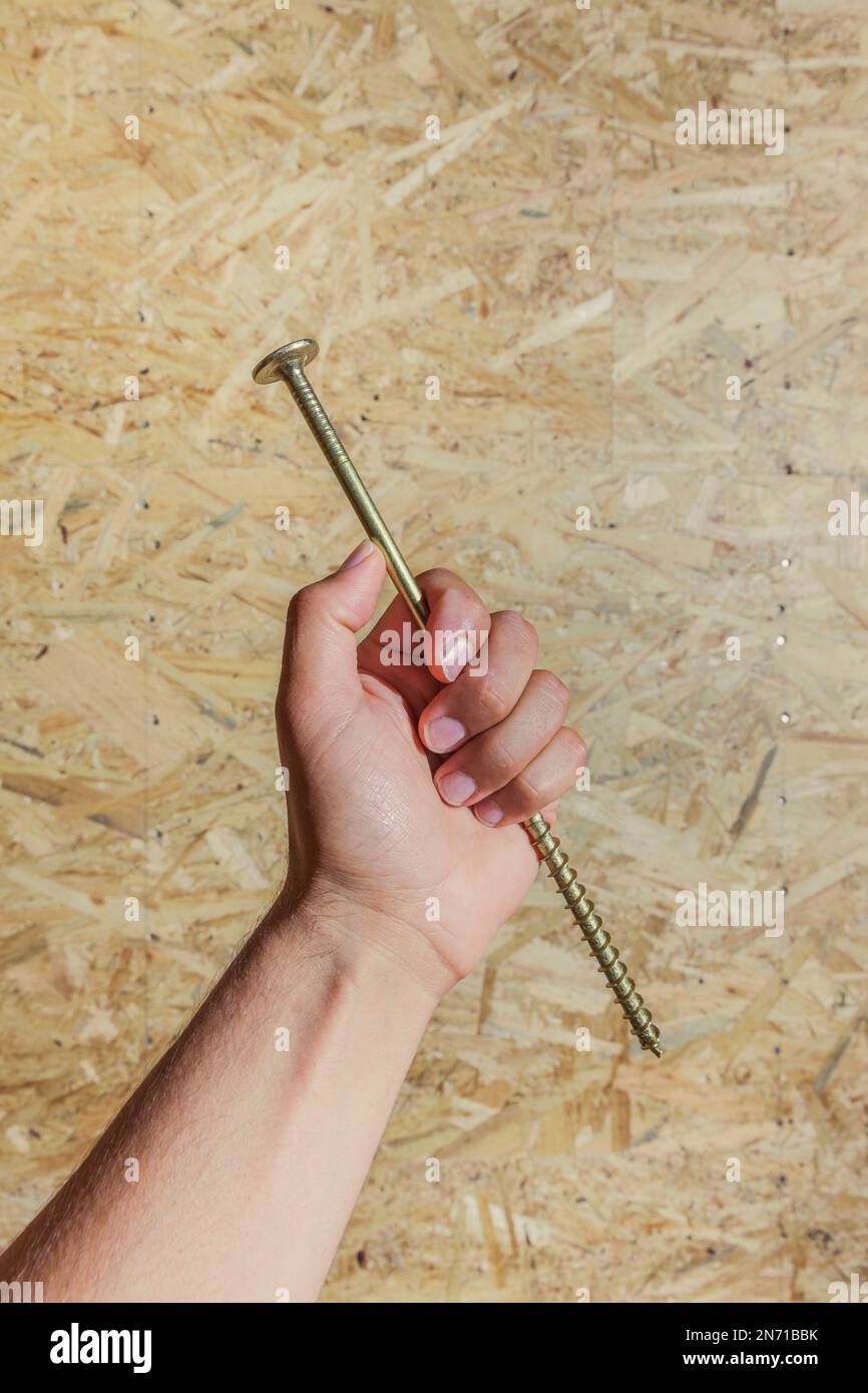 Big screw in the hand of a craftsman hi-res stock photography and ...
