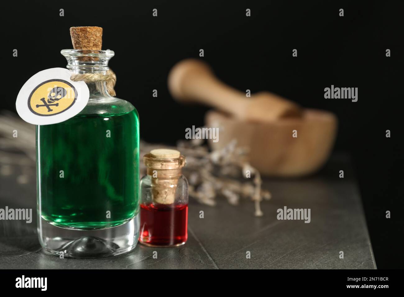 Bottles with poison on grey table. Space for text Stock Photo - Alamy
