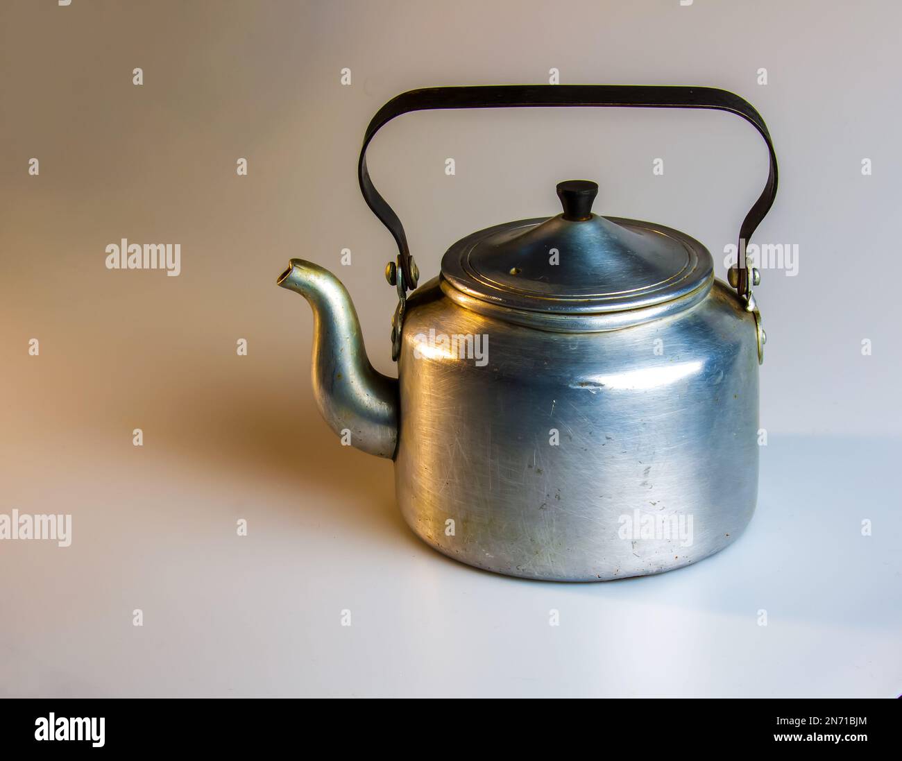 Old soldier's aluminum teapot from the Second World War on a white ...