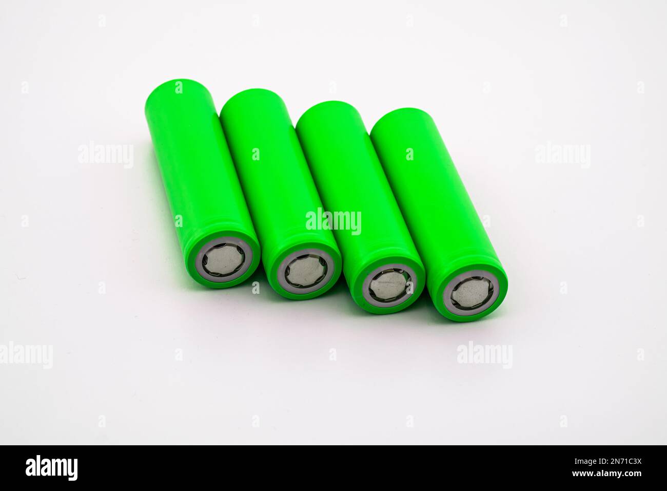 The green batteries isolated on white background Stock Photo - Alamy