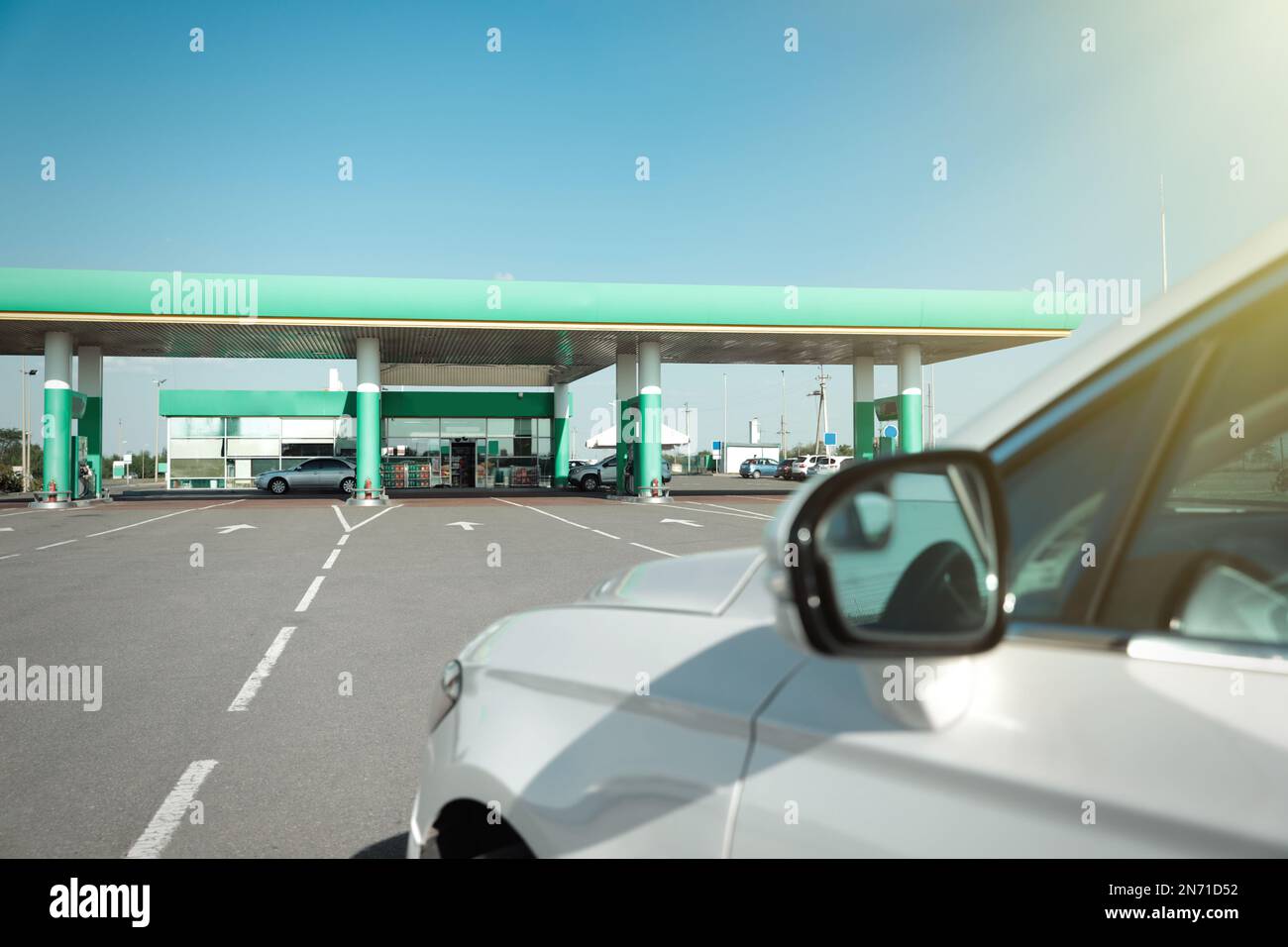 Modern car driving to gas station, closeup Stock Photo - Alamy