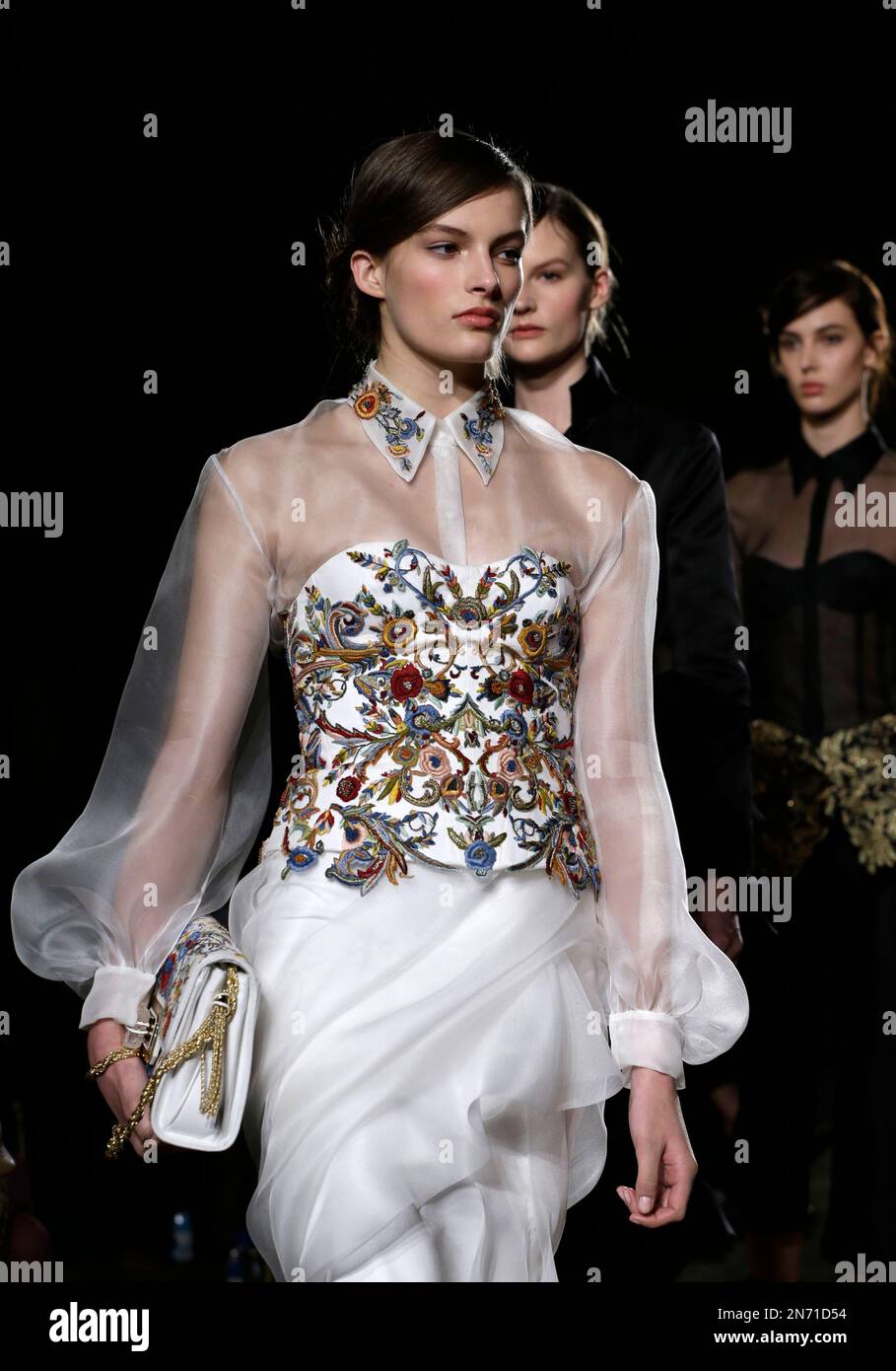 FILE - This Feb. 13, 2013 file photo shows models wearing sheer fashion ...