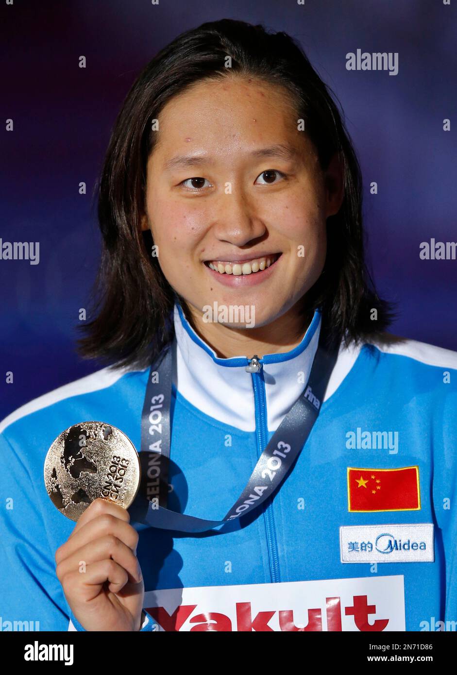 China's Liu Zige smiles as she holds the gold medal she won in the ...