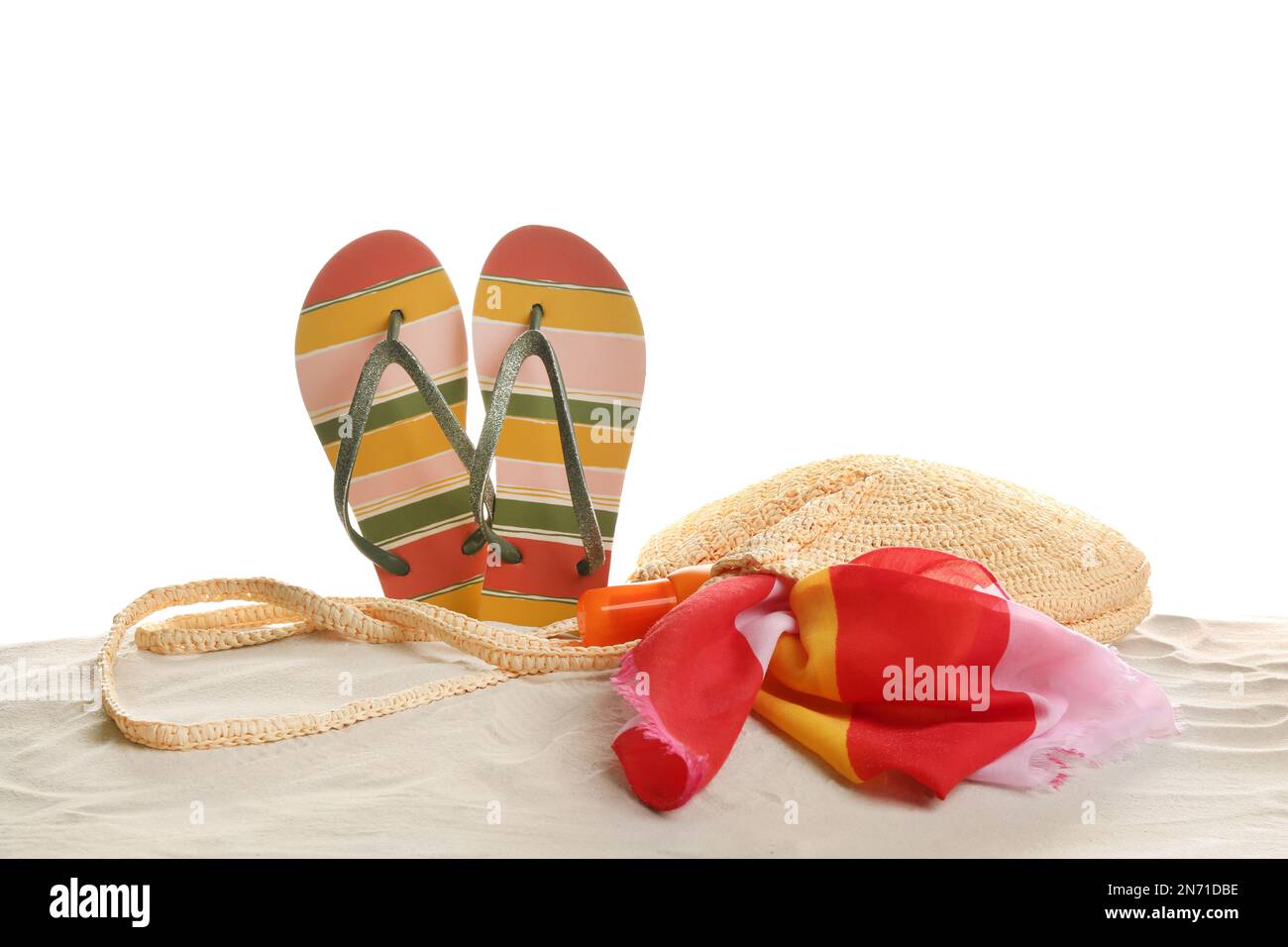 Different beach accessories on sand against white background Stock ...