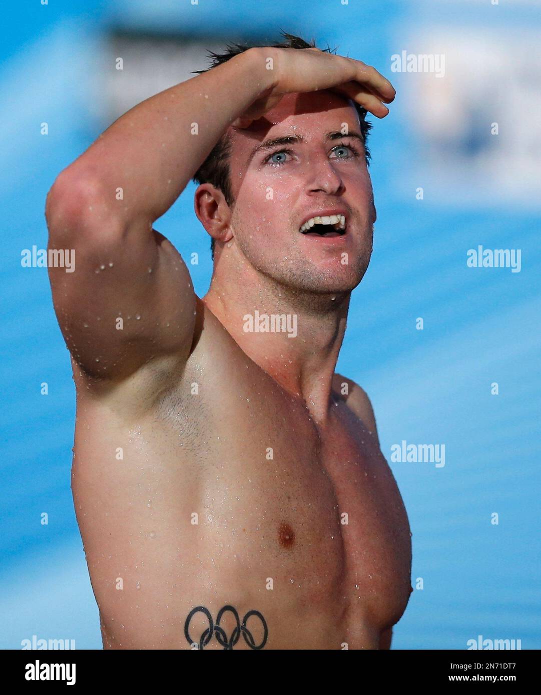 Australia's James Magnussen looks up as he leaves the pool after ...