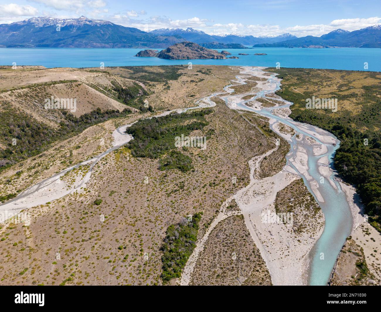 Aerial View of a creek flowing to the beautiful Lago General Carrera in ...