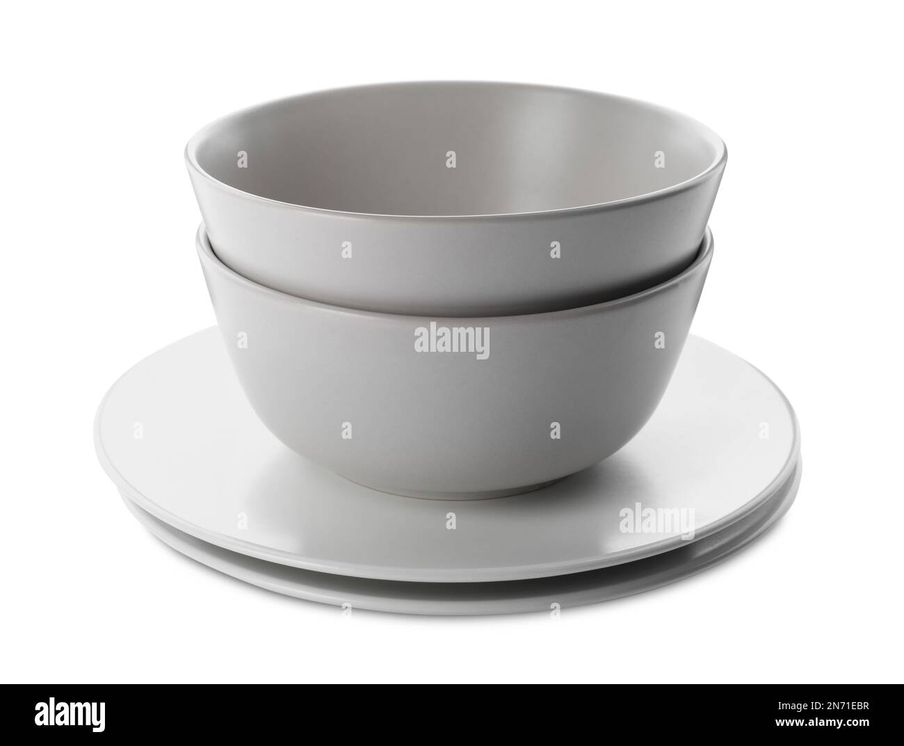Stack of clean plates and bowls on white background Stock Photo - Alamy