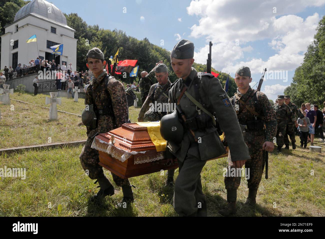Ukrainians dressed in the SS Galychyna Division uniform carry a coffin ...
