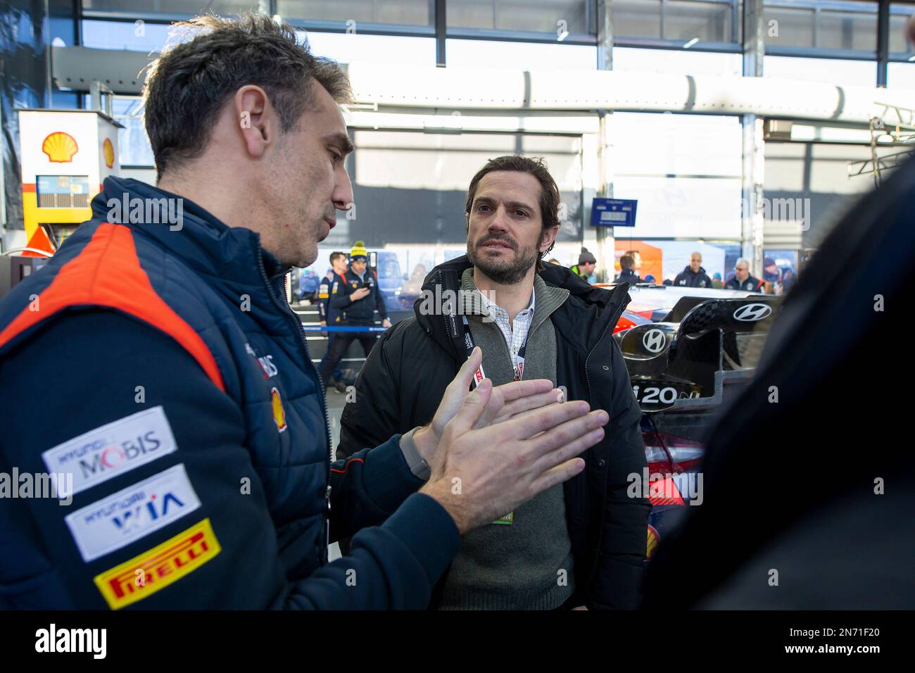 Prince Carl Philip of Sweden (R) talks to Cyril Abiteboul, team ...