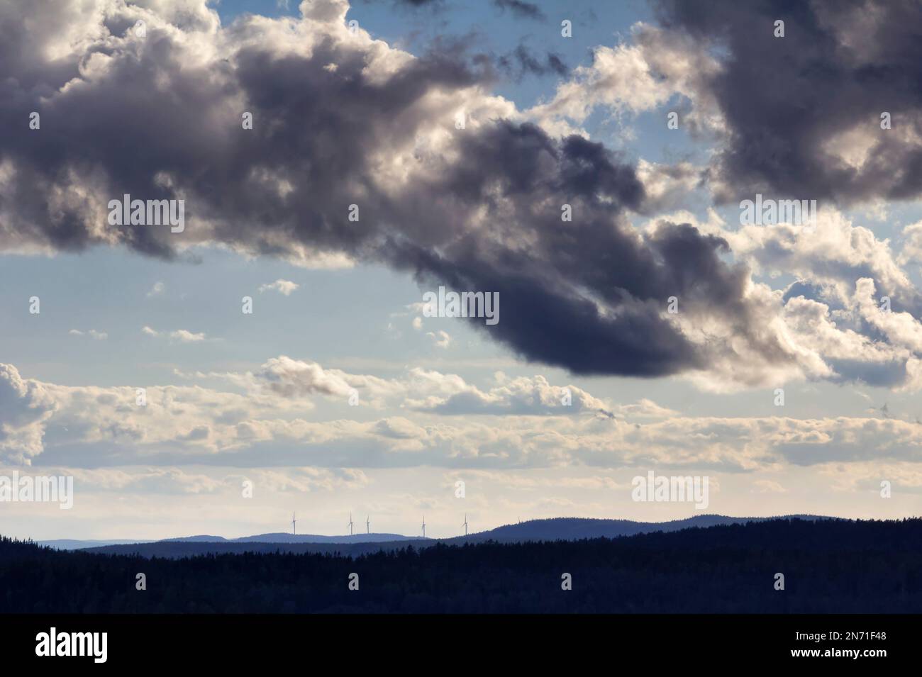 Dramatic rain clouds with blue sky in the background Stock Photo - Alamy