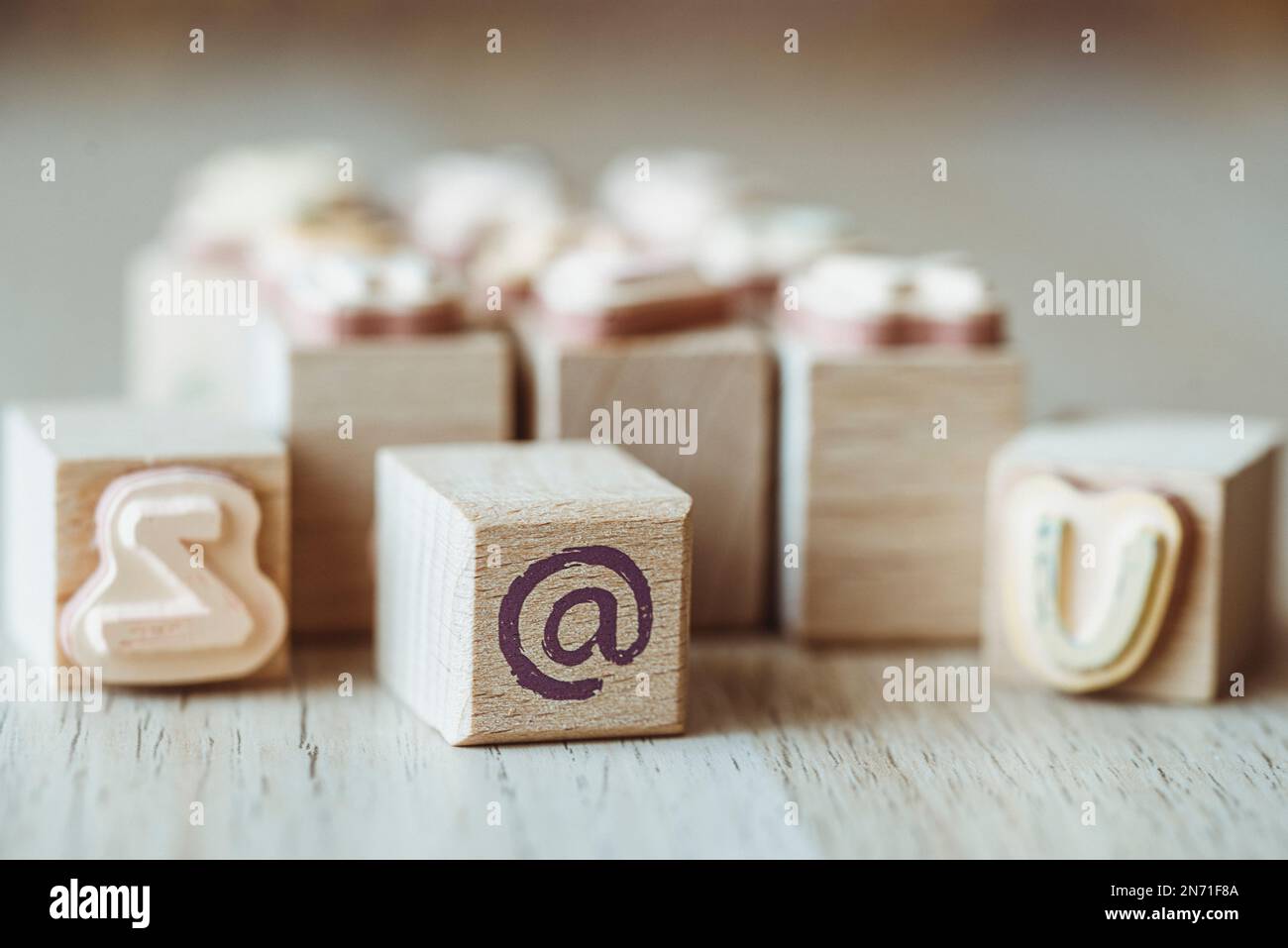 Close-up stack of wooden stamps with capital letters Stock Photo - Alamy