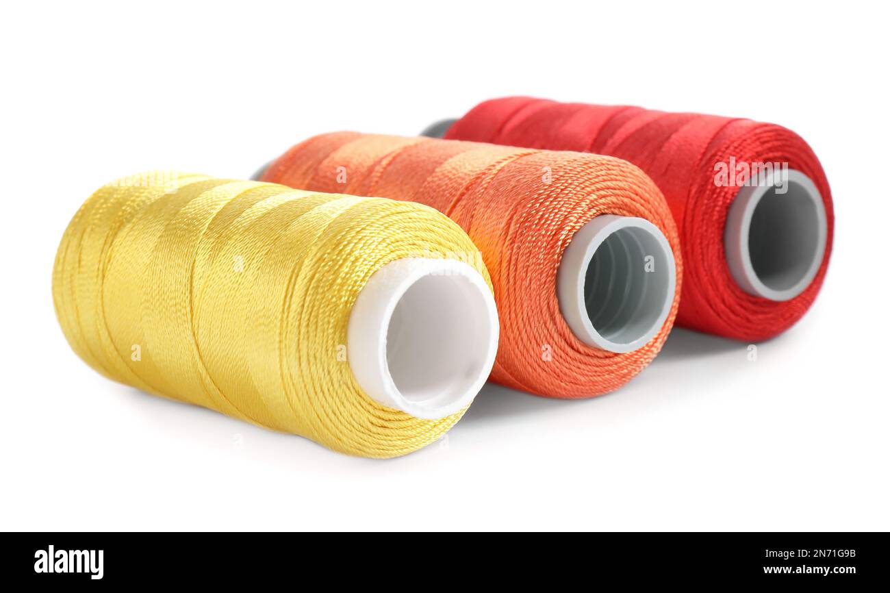 Set of colorful sewing threads on white background Stock Photo - Alamy