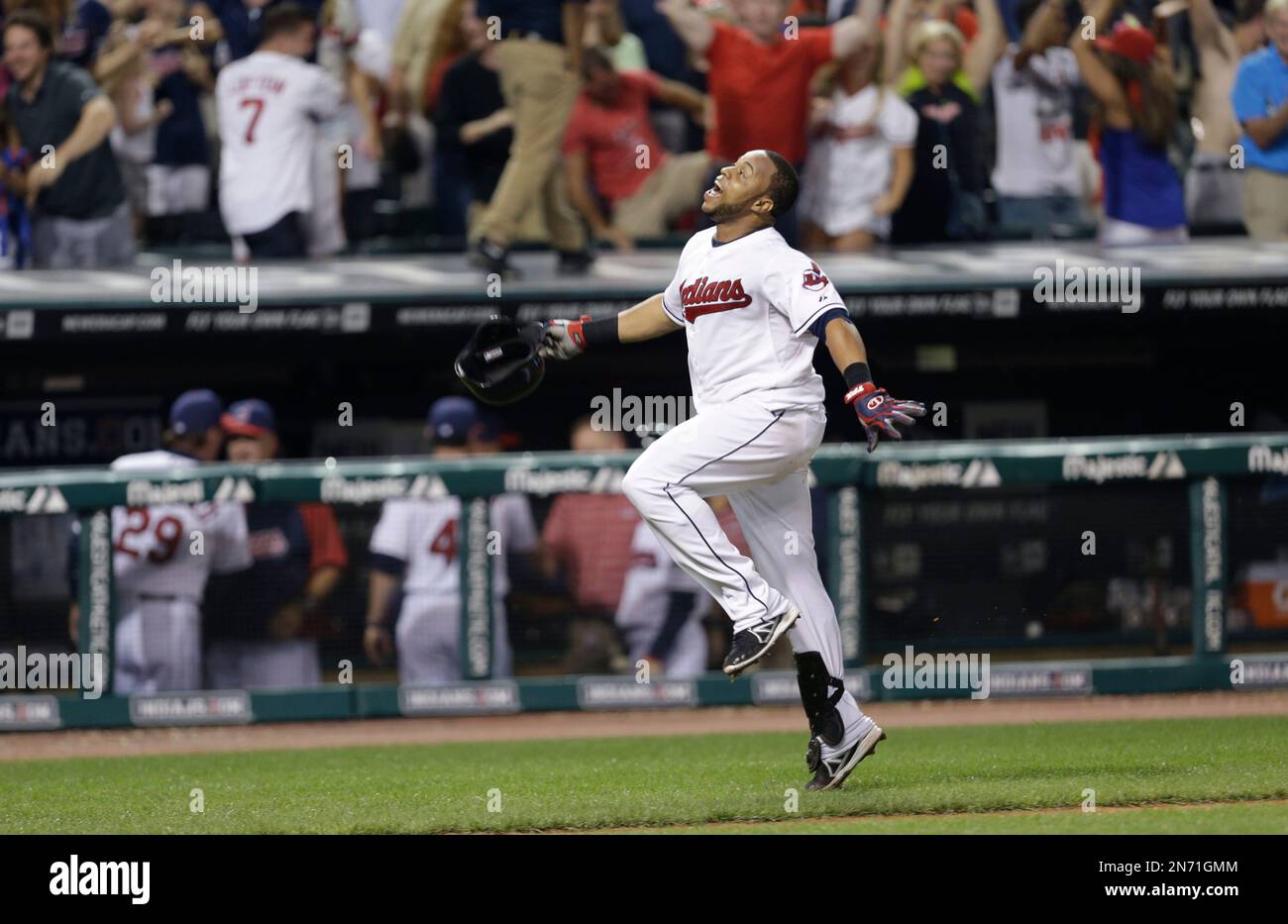 Cleveland Indians' Carlos Santana celebrates after rounding third base ...