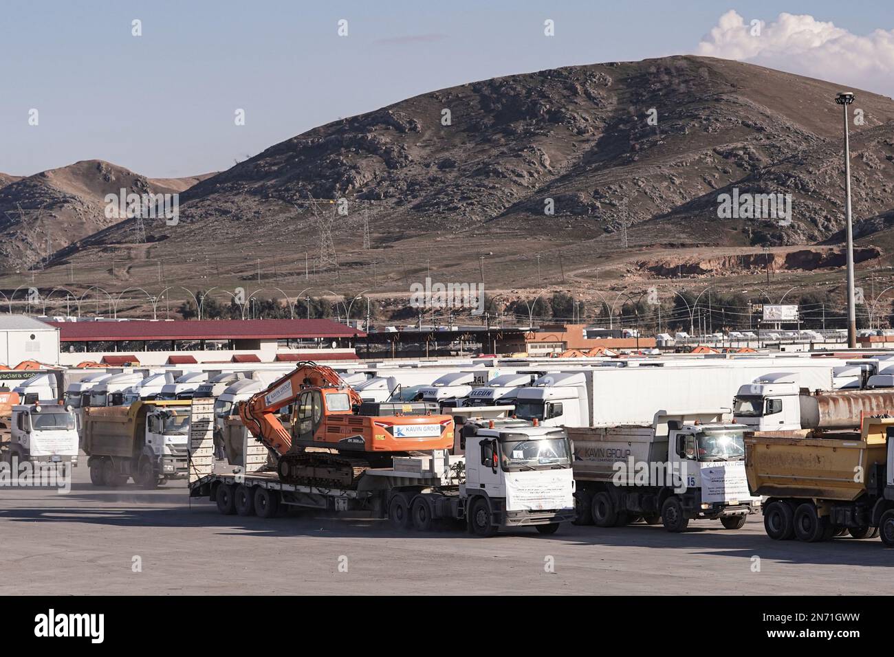 Dihok, Iraq. 10th Feb, 2023. Heavy vehicles and machinery pass through ...