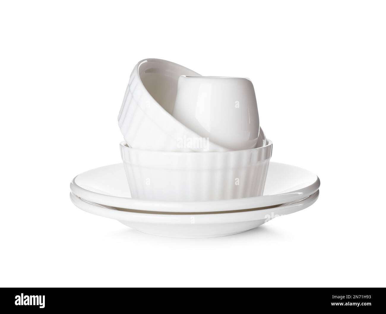 Stack of ceramic dishware on white background Stock Photo - Alamy