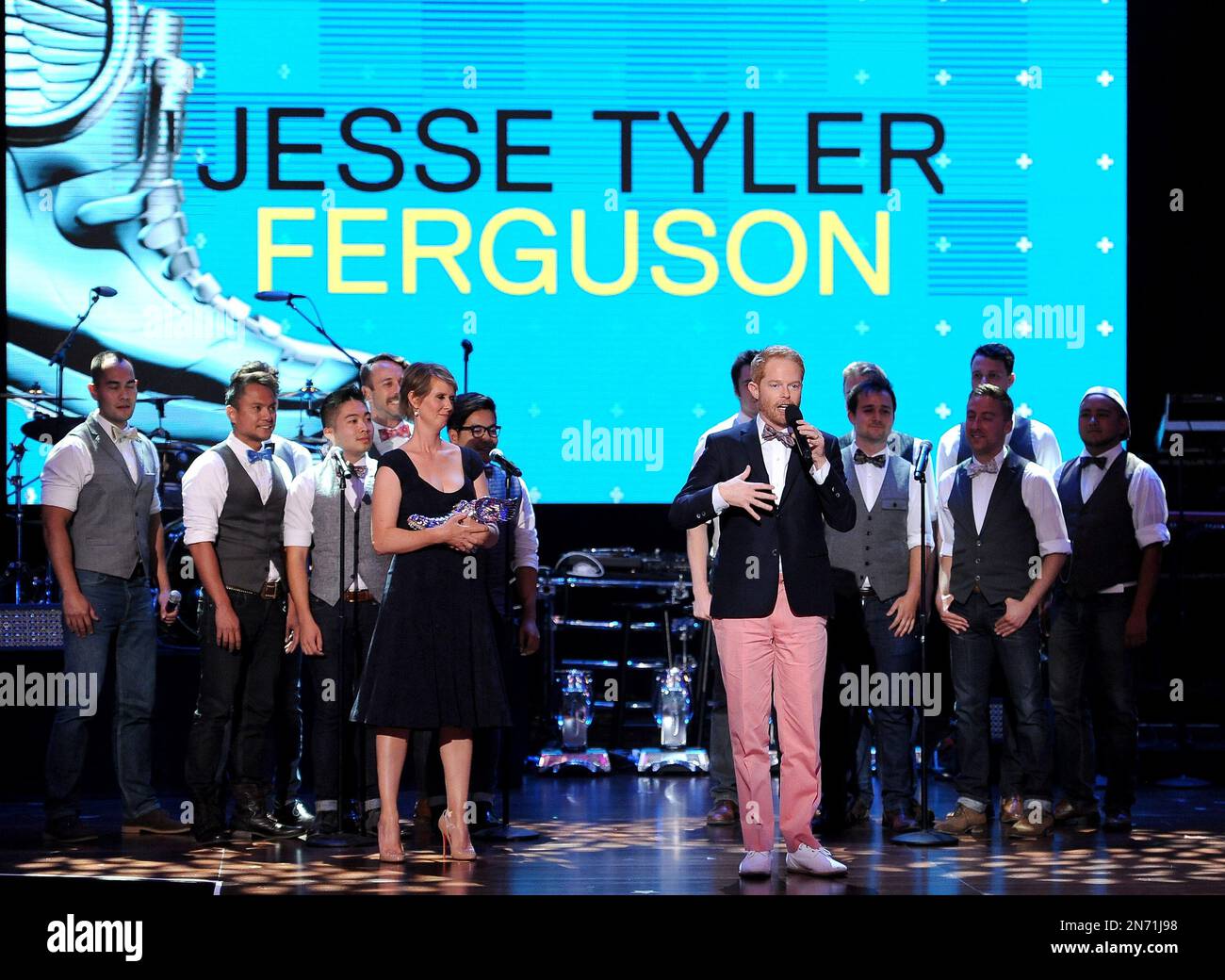 From left, Cynthia Nixon presents honoree Jesse Tyler Ferguson with an ...