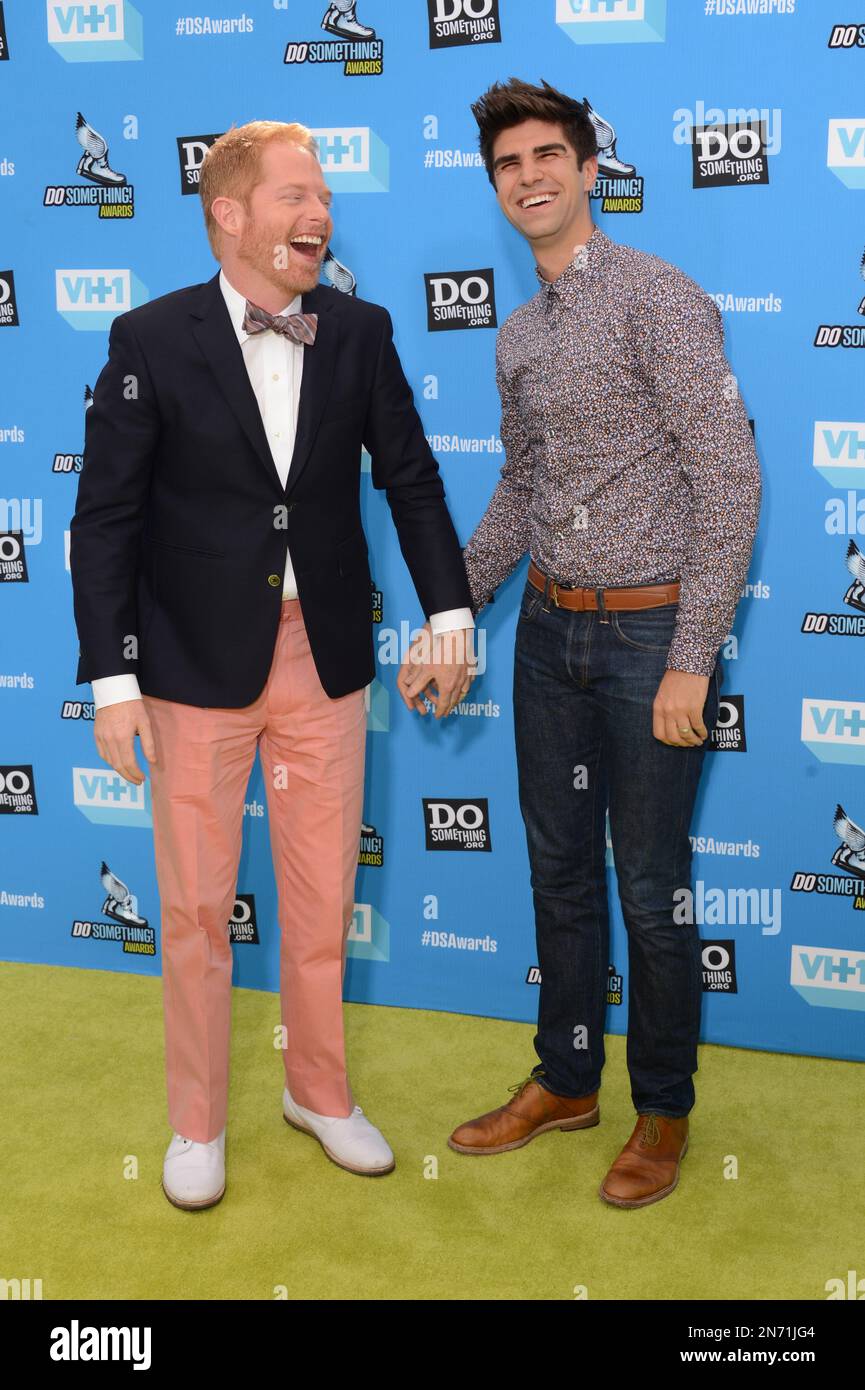Jesse Tyler Ferguson, left, and Justin Mikita arrive at the Do ...