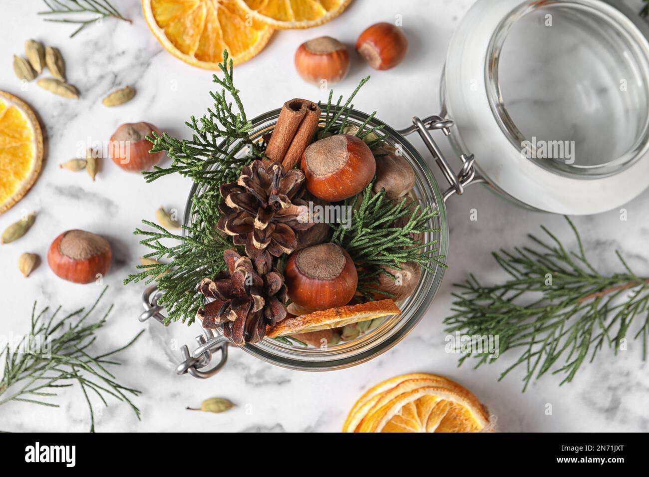 Aroma potpourri with different spices on white marble table, flat lay ...