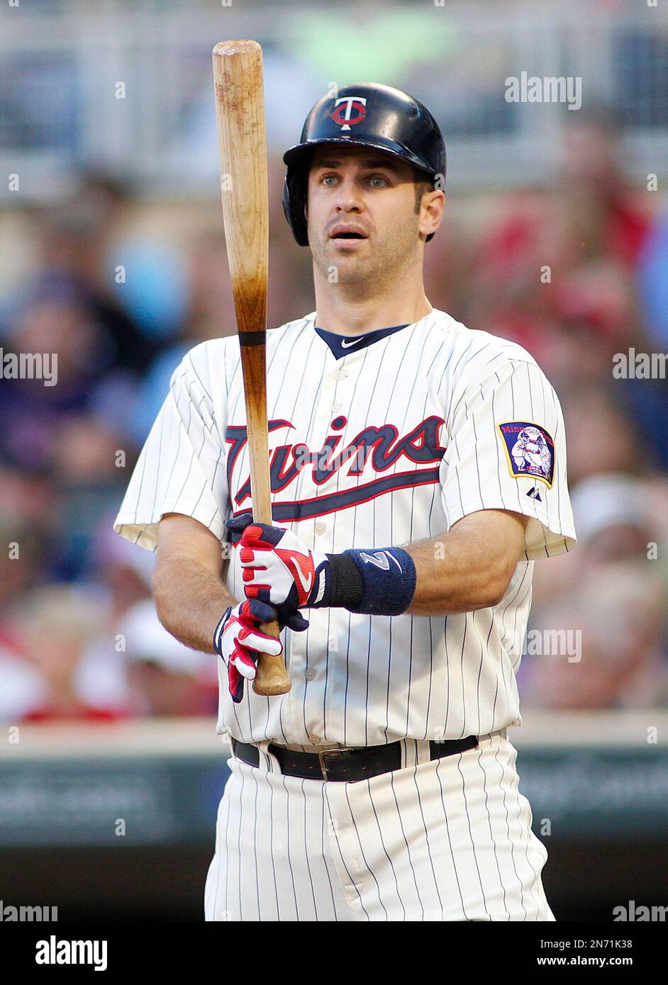 Minnesota Twins catcher Joe Mauer pauses before batting in the first ...