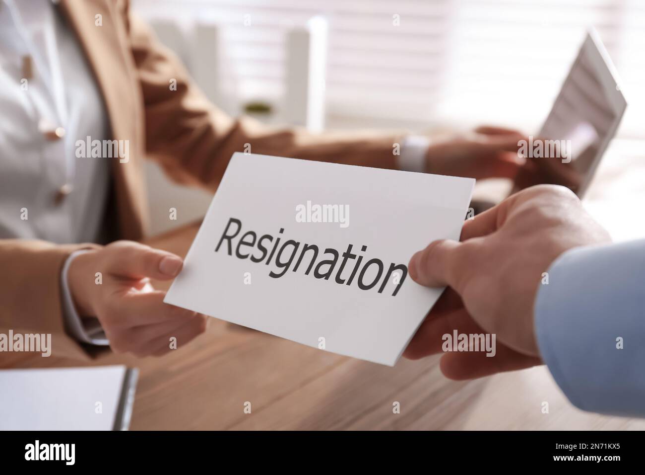 Employee giving resignation letter to boss in office, closeup Stock ...