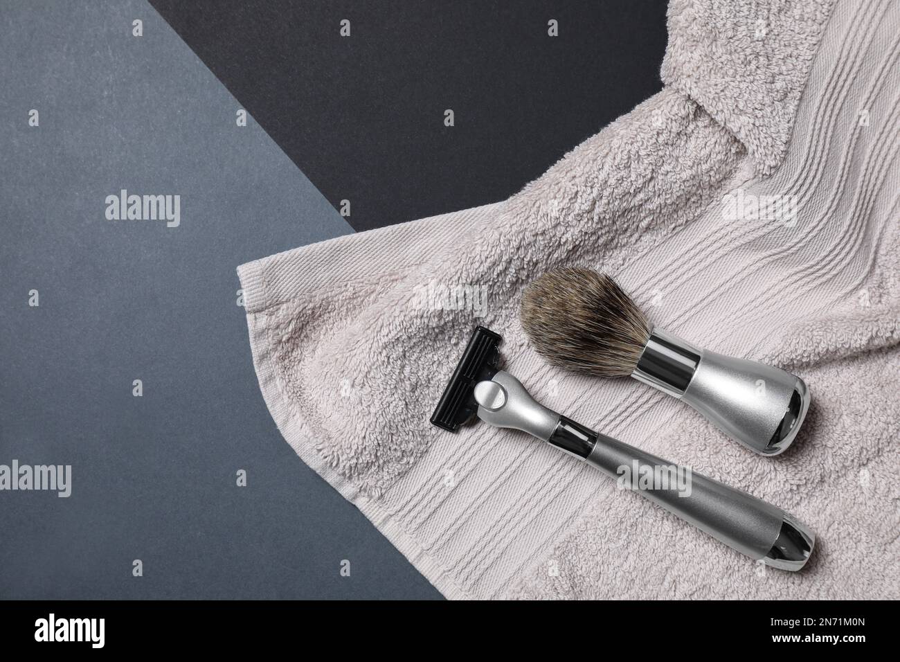 Razor, brush and towel for shaving on dark background, flat lay Stock ...