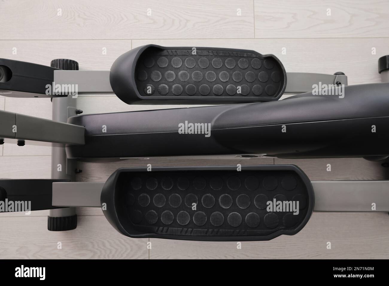 Modern elliptical machine cross trainer on floor, top view Stock Photo ...