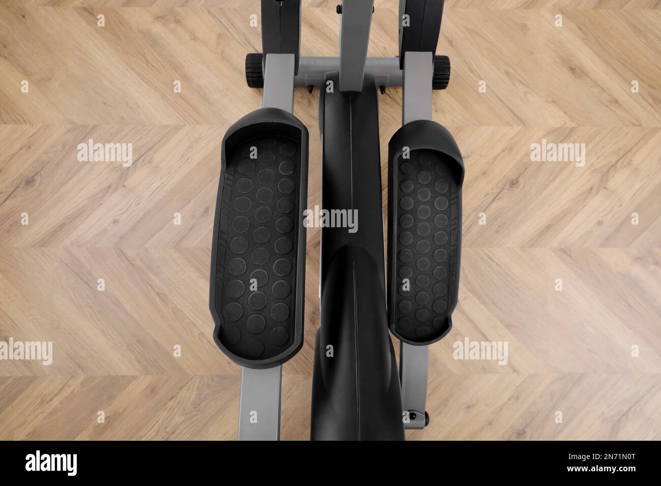 Modern elliptical machine cross trainer on floor, top view Stock Photo ...