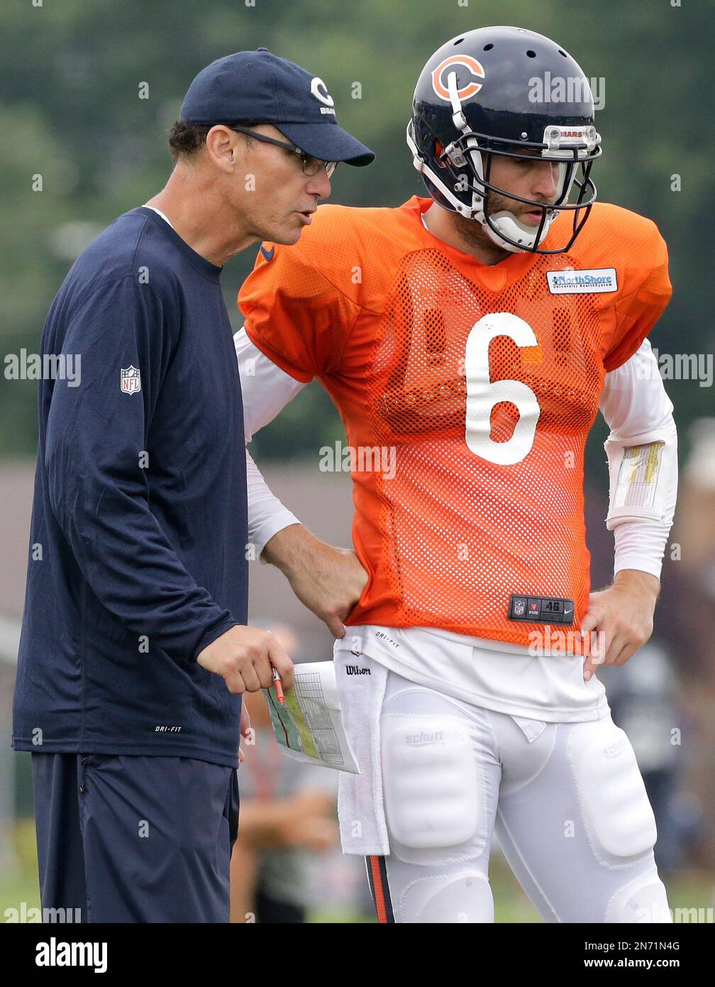 Chicago Bears head coach Marc Trestman, left, talks with quarterback ...