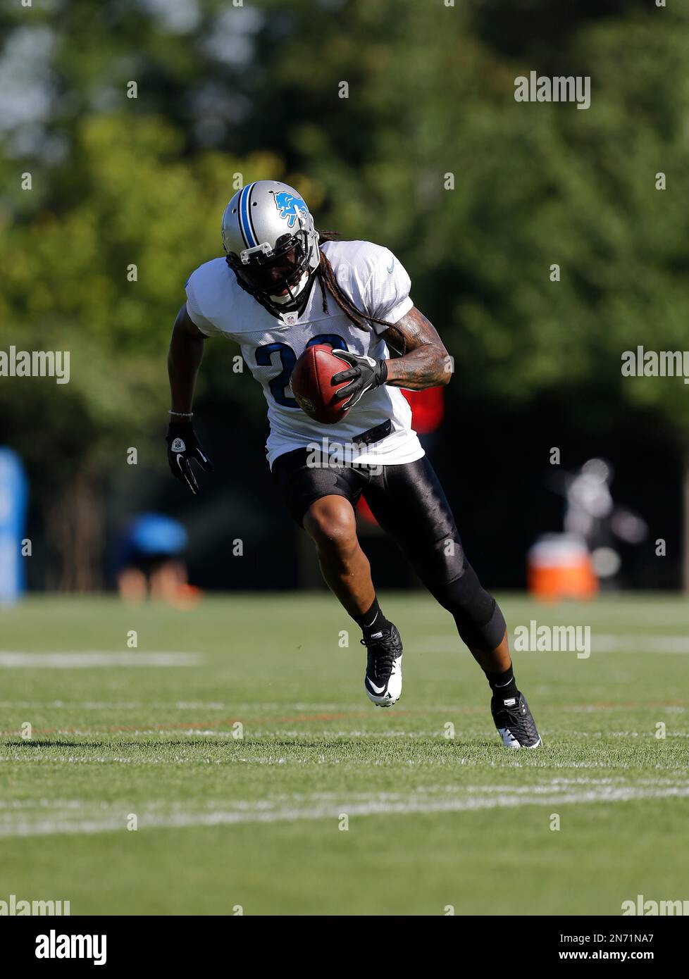 Detroit Lions free safety Louis Delmas runs with a ball at the teams ...