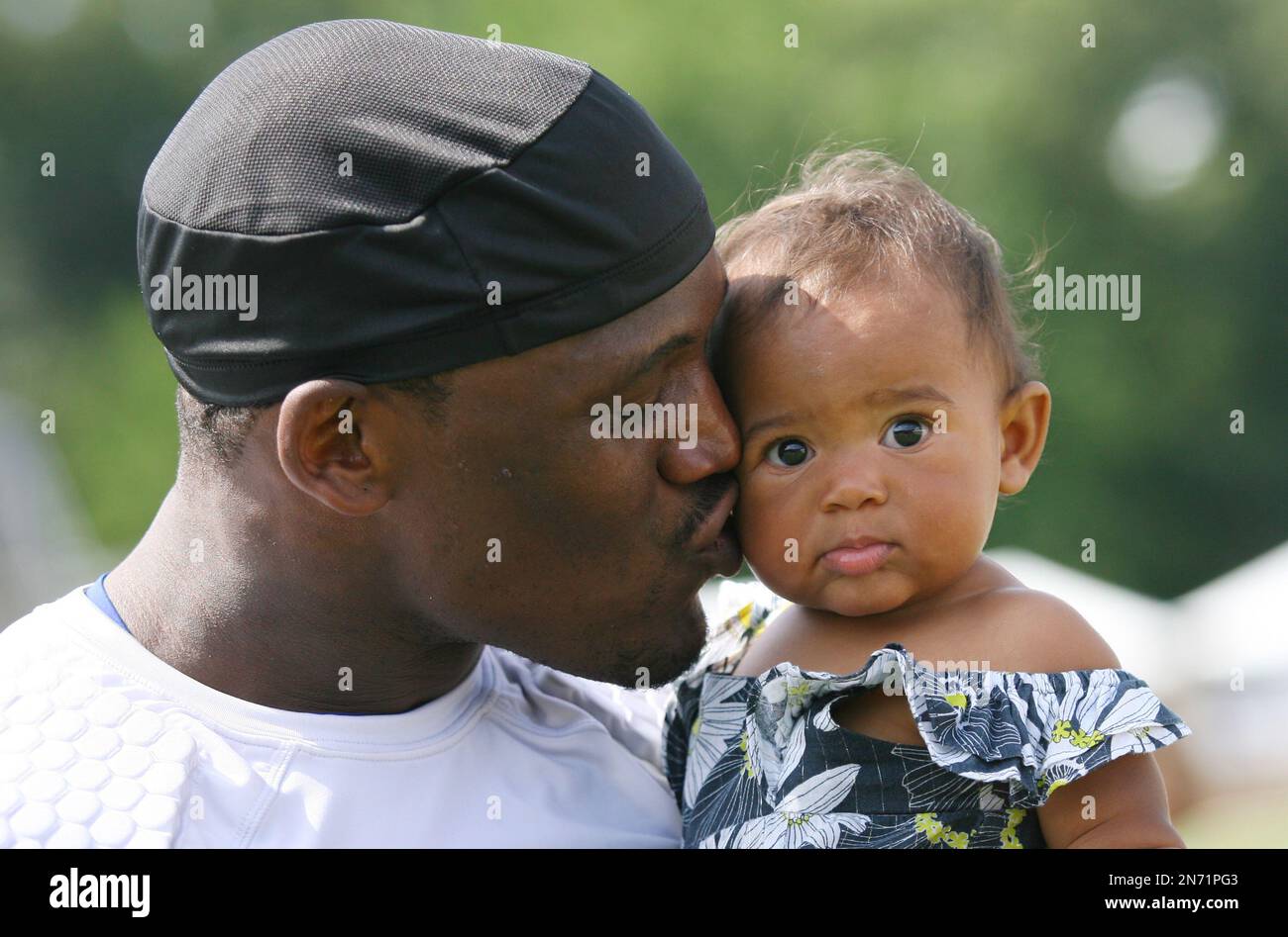 Buffalo Bills linebacker Arthur Moats kisses his nine-month-old ...