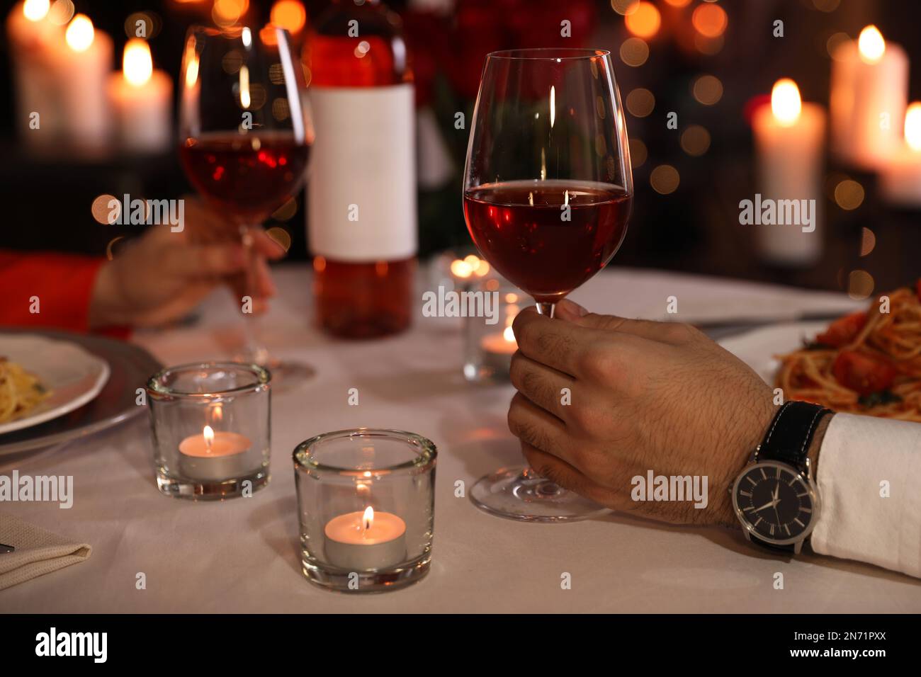 Couple having romantic dinner in restaurant, closeup Stock Photo - Alamy