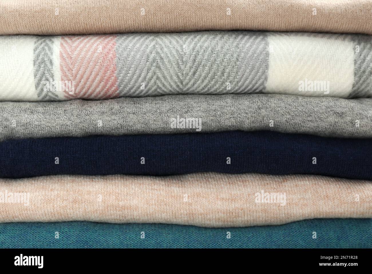 Stack of cashmere clothes as background, closeup Stock Photo - Alamy
