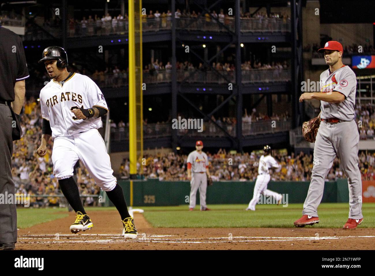 Pittsburgh Pirates right fielder Jose Tabata (31) scores on a passed ...