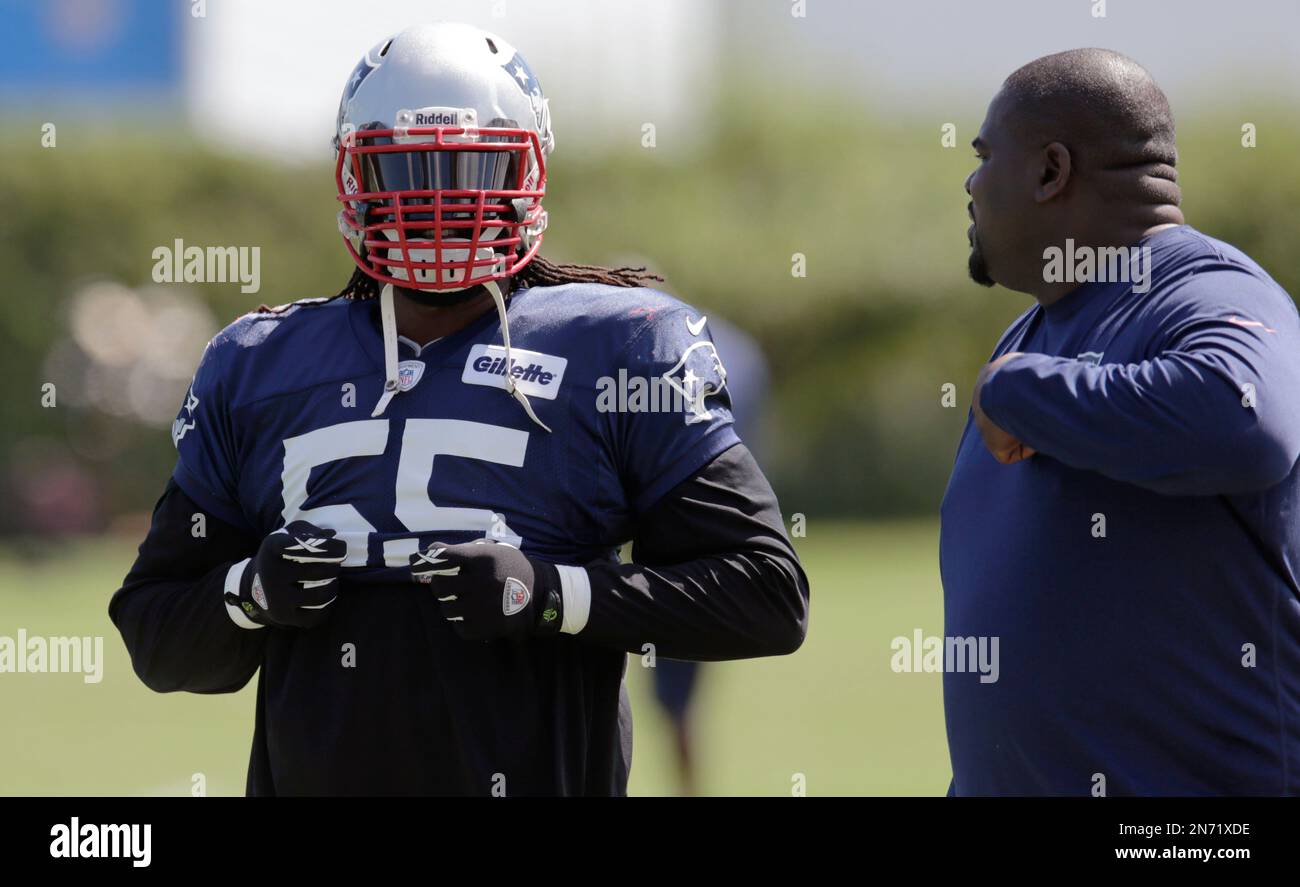 New England Patriots linebacker Brandon Spikes (55) talks with coach ...
