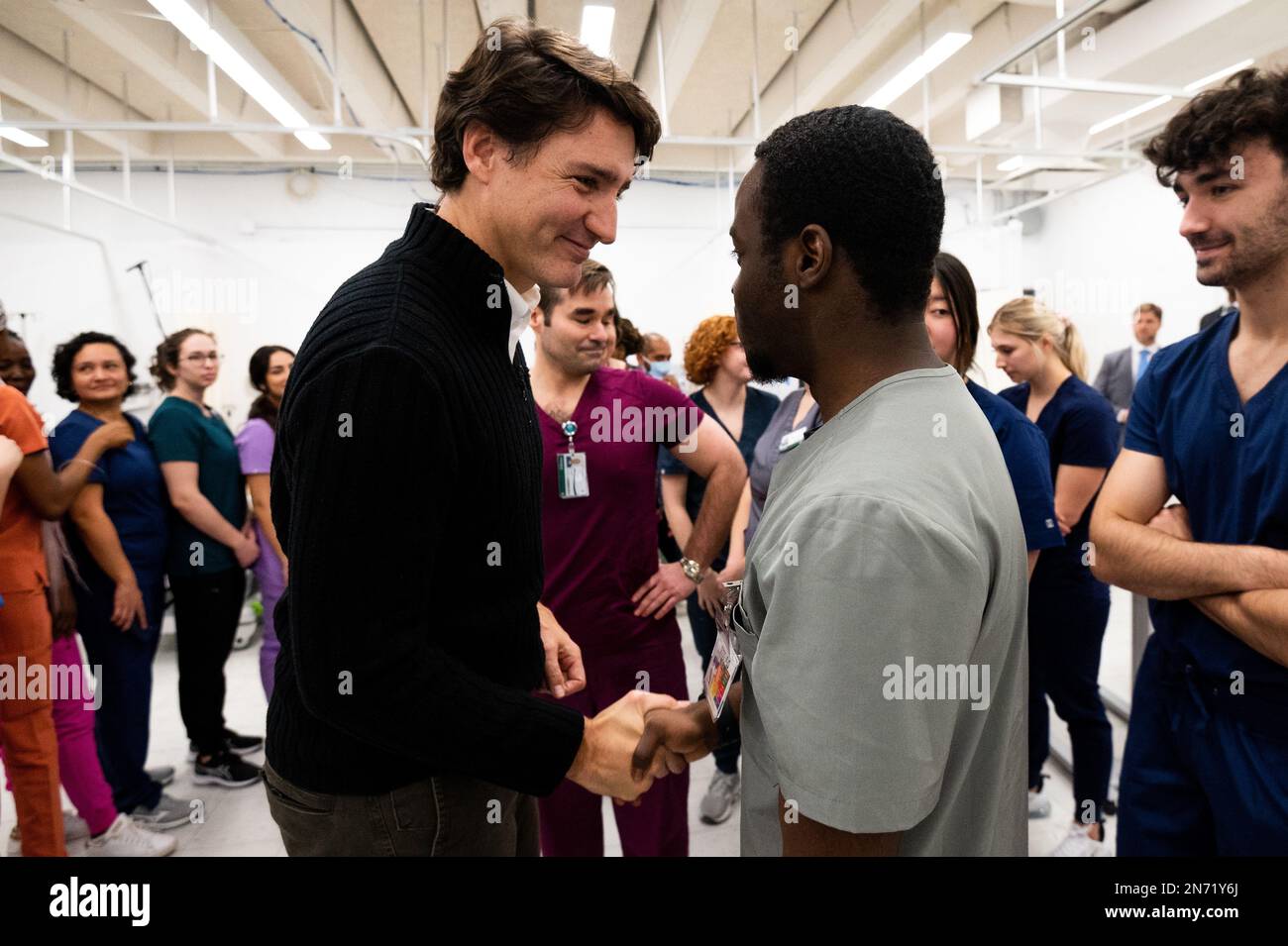 Prime Minister Justin Trudeau shakes the hand of a nursing student at ...