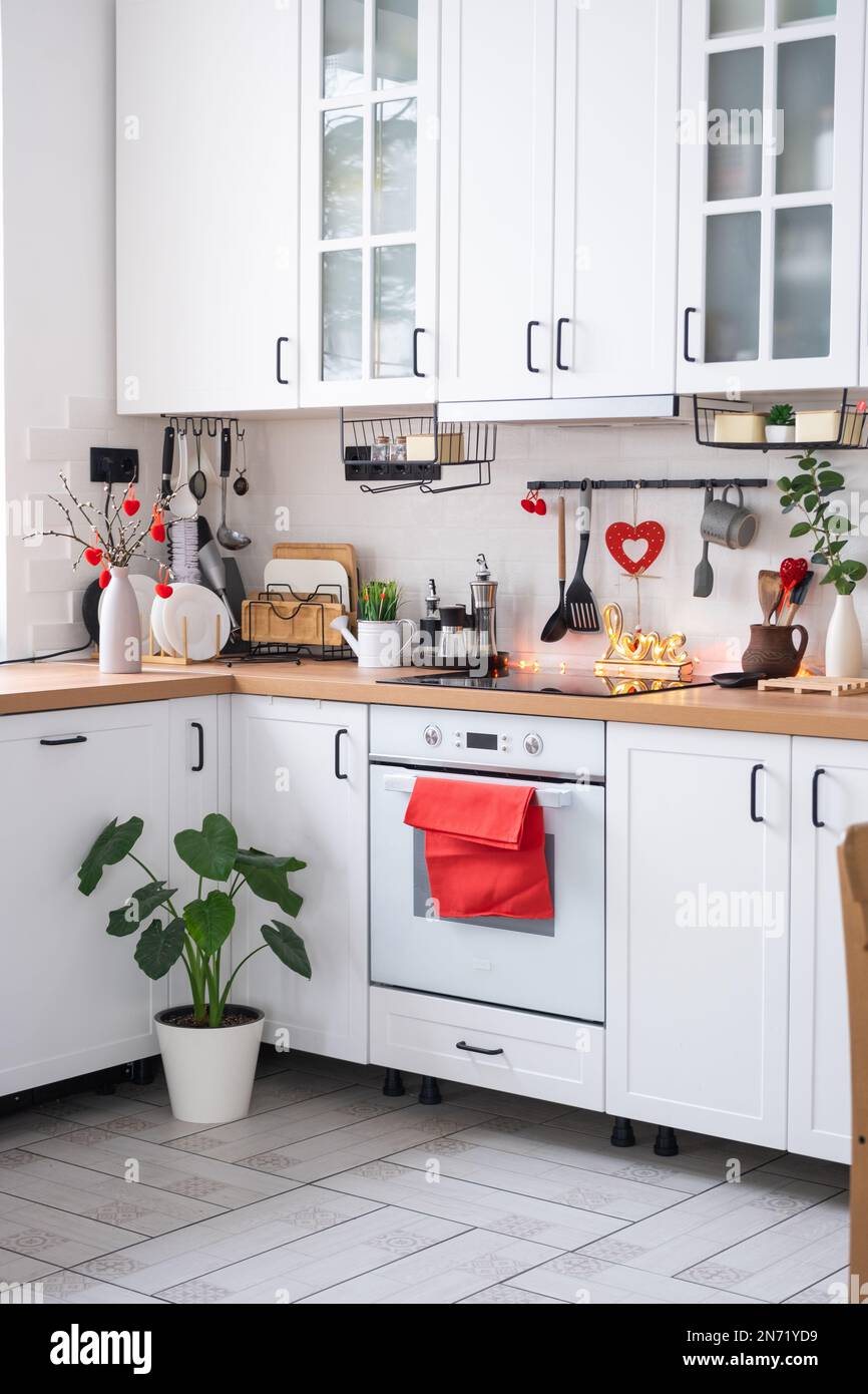 The interior of the kitchen in the house is decorated with red hearts ...