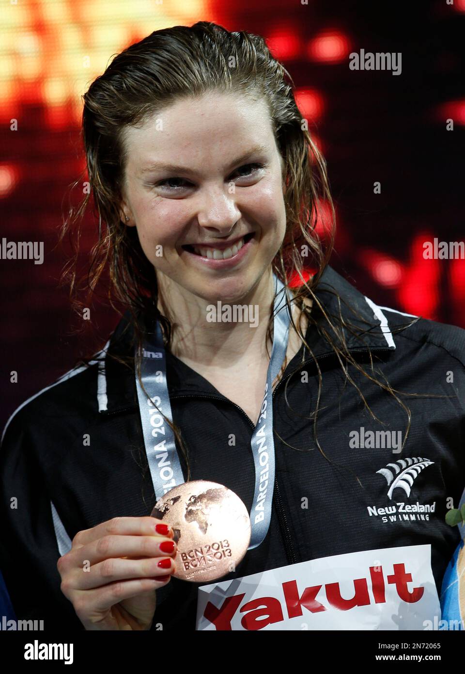 New Zealand's Lauren Boyle smiles as she holds her bronze medal during ...