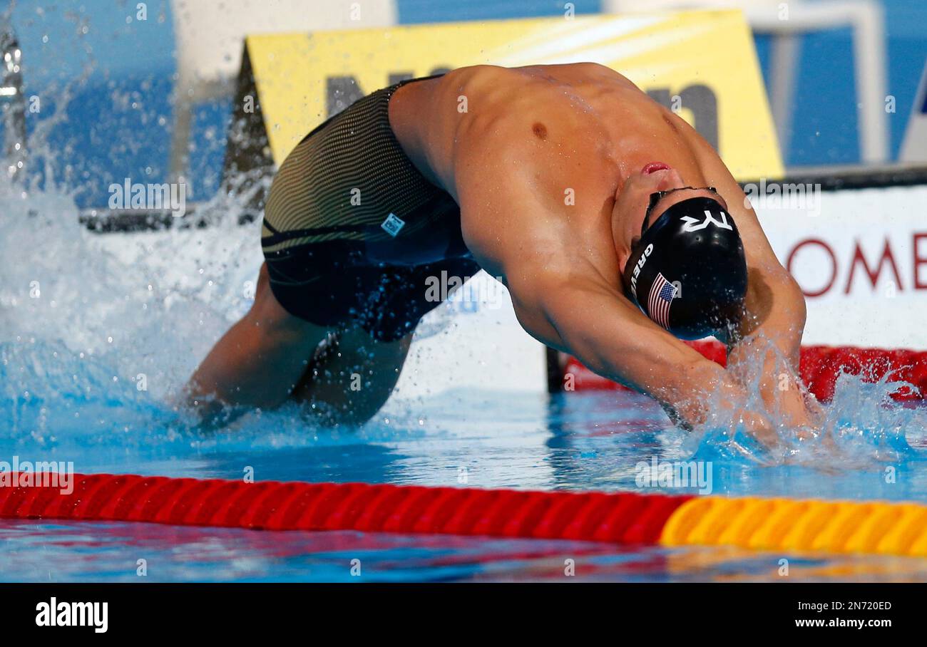 Matt Grevers of the United States starts on his way to winning the Men ...