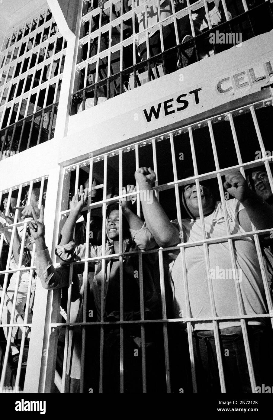 FILE - In this July 28, 1973 file photo, convicts give the "V" for ...