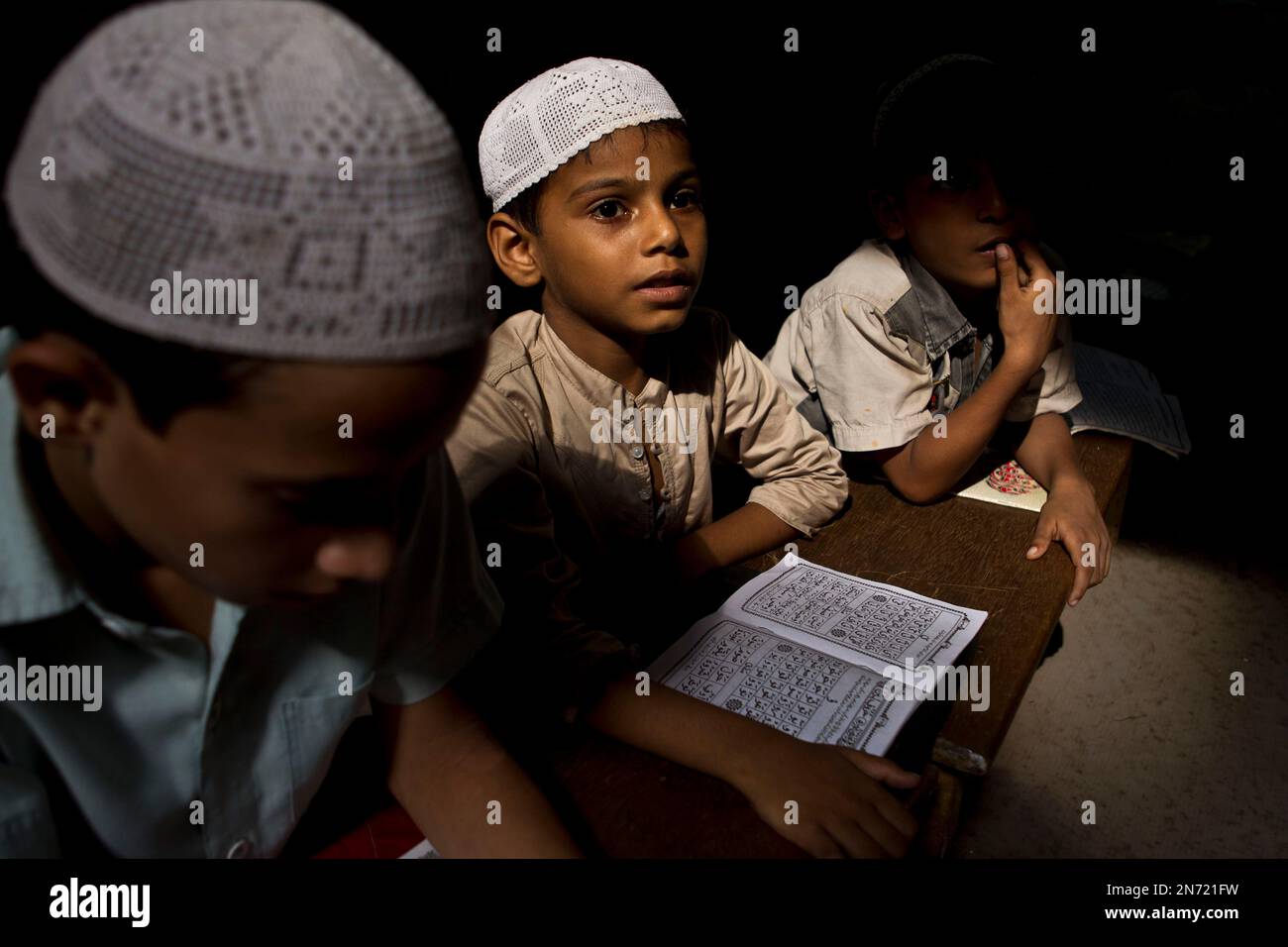 Indian Muslim children take lessons on the Quran at a Madrasa or Muslim ...