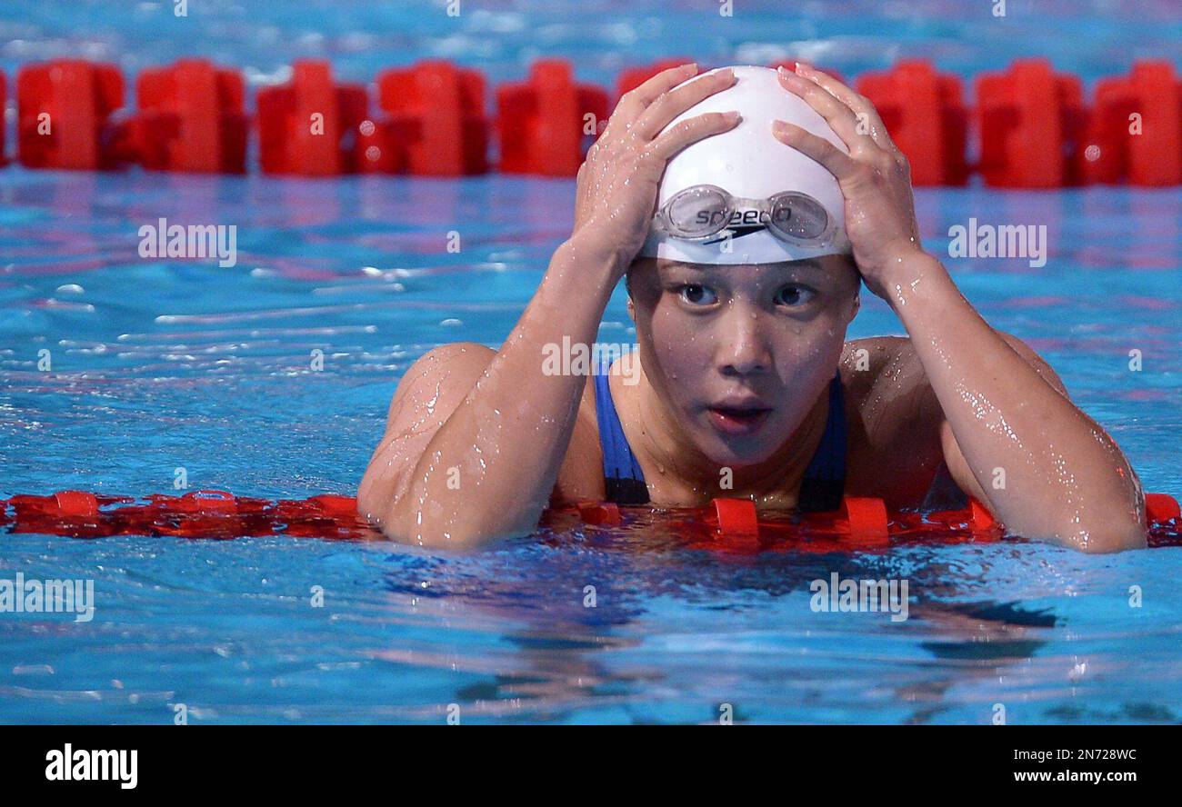 Hong Kong's Stephanie Au Hoi Shun holds her head after finishing a ...