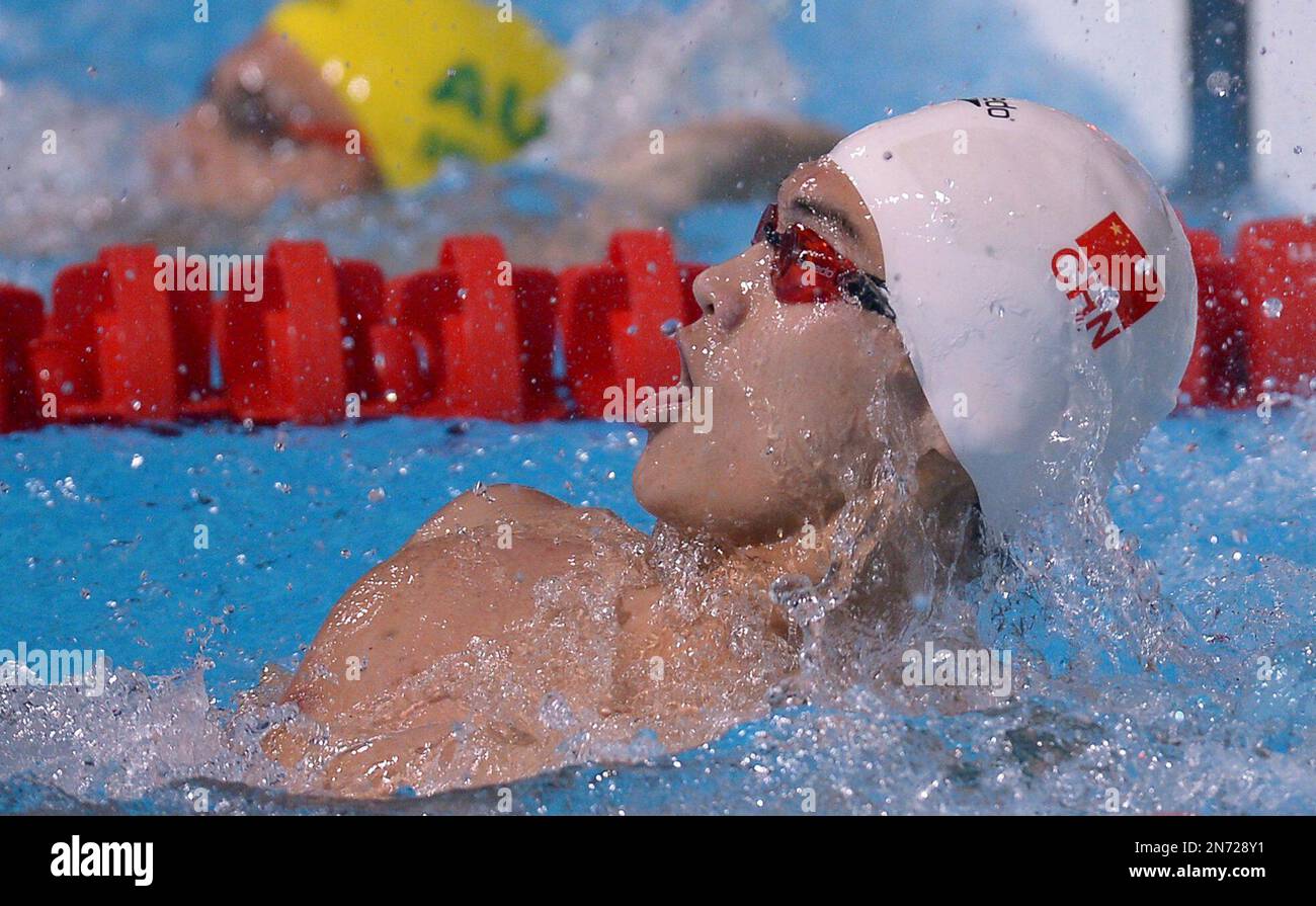 China's Xu Jiayu looks up after finishing a Men's 100m backstroke heat ...