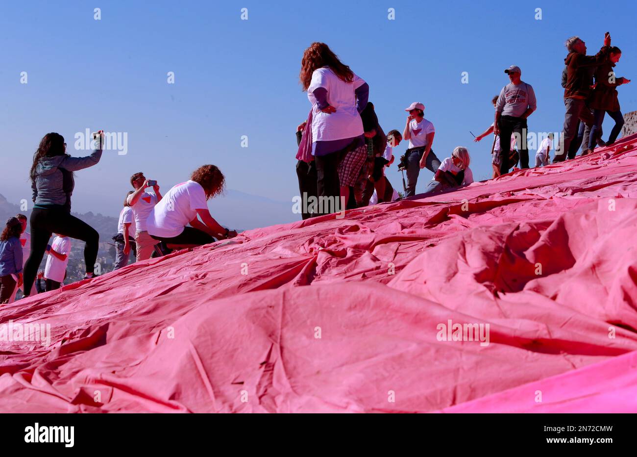 Volunteers busy at work duirng the annual installation of the Pink ...