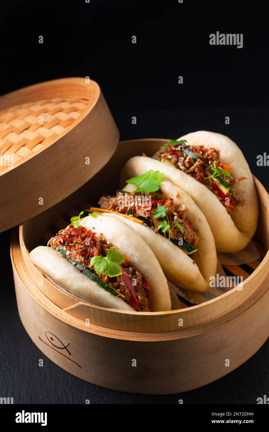 Food concept Homemade organic Pulled Beef Bao Buns or Gua Bao in bamboo ...