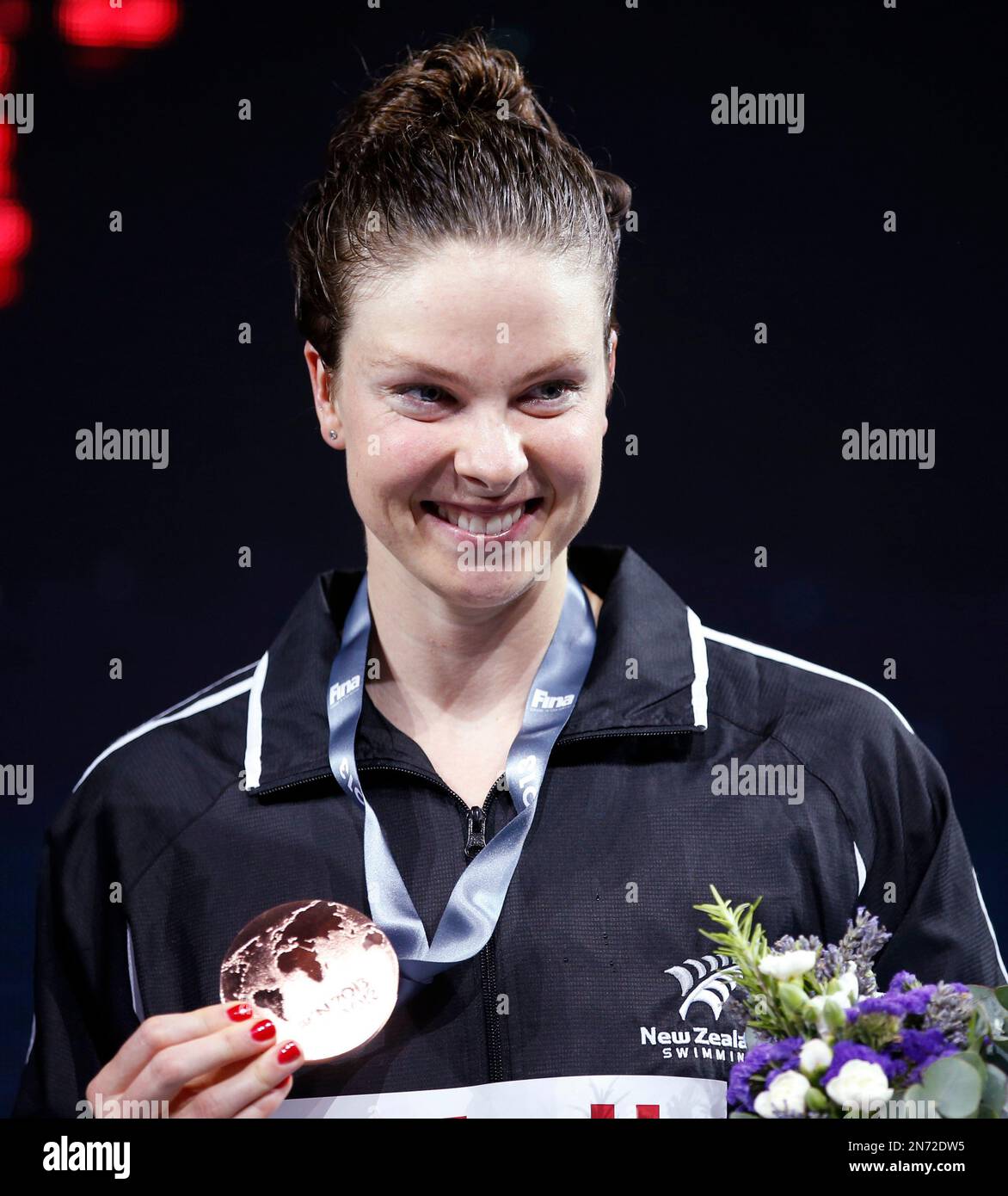 New Zealand's Lauren Boyle smiles as she holds her bronze medal after ...