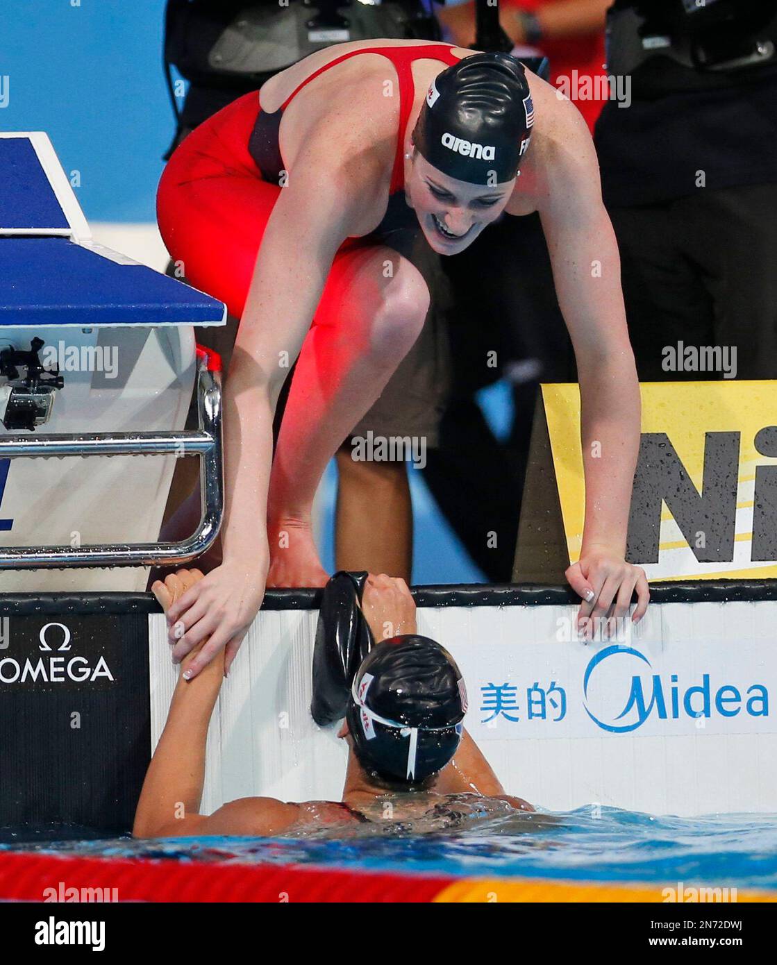 United States' Missy Franklin, top, greets Megan Romano after she ...
