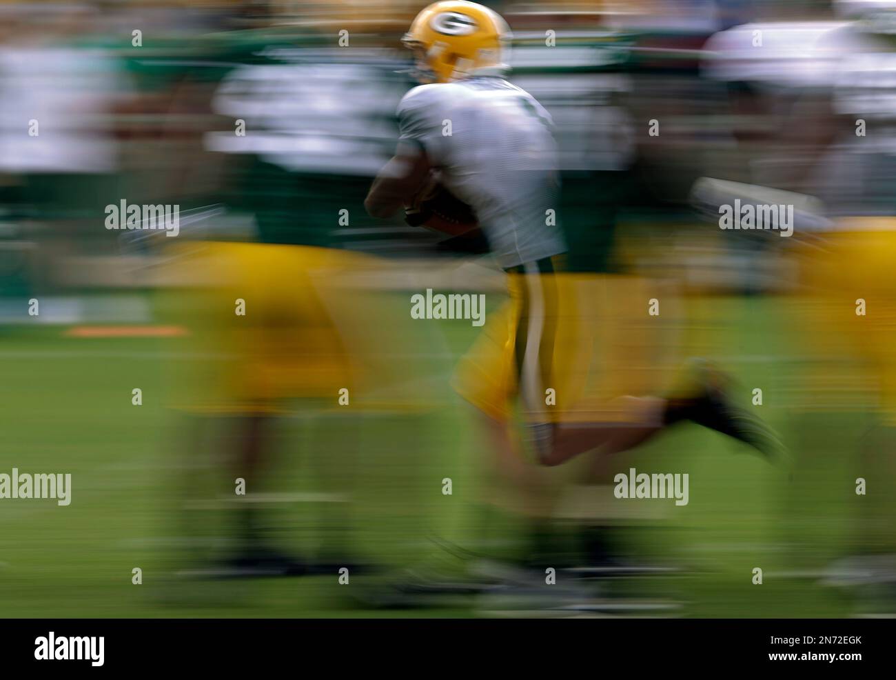 Green Bay Packers' Alex Gillett runs through a ball control drill ...