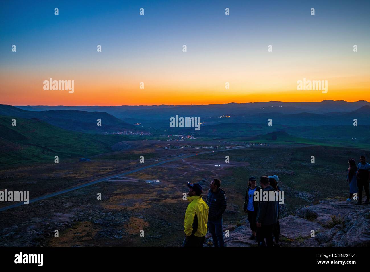 A group of tourists enjoying the beautiful sunset the from top of The ...
