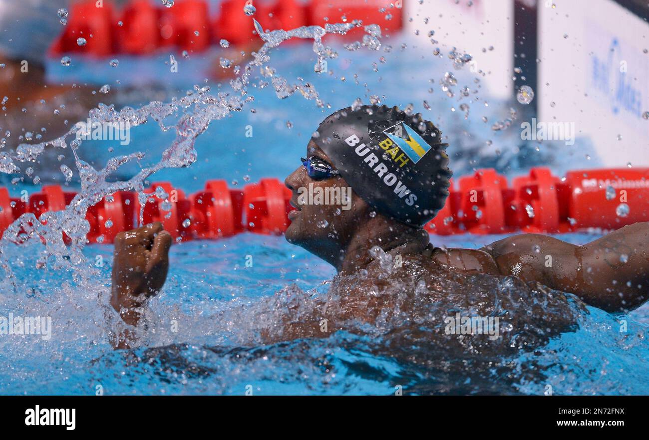 Bahamas's Elvis Burrows gestures after finishing a heat of the Men's 50m butterfly at the FINA ...