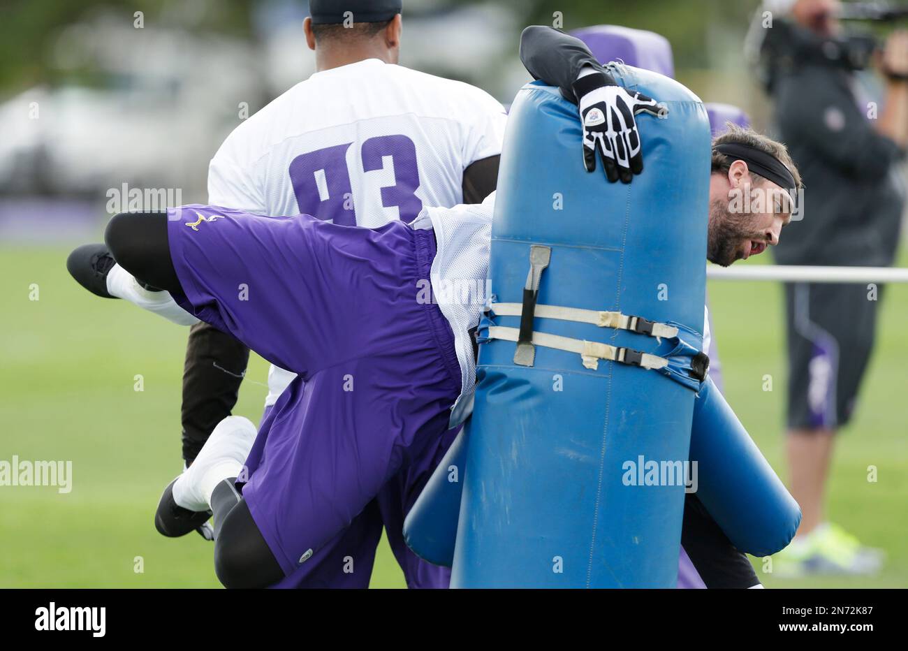 Minnesota Vikings defensive end Jared Allen hits a tackling dummy ...